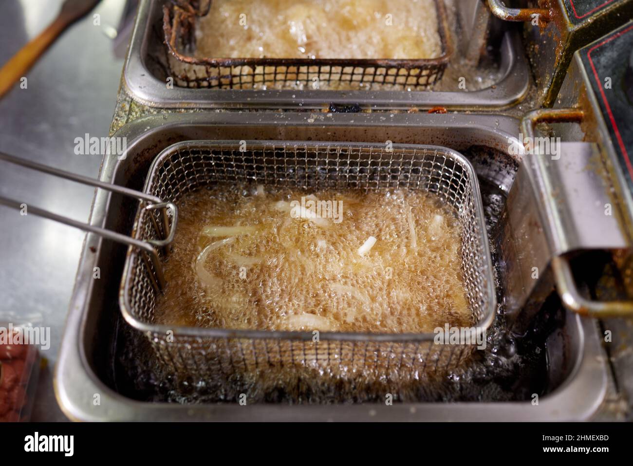 Dirty cooking area with french fries deep fryer Stock Photo - Alamy