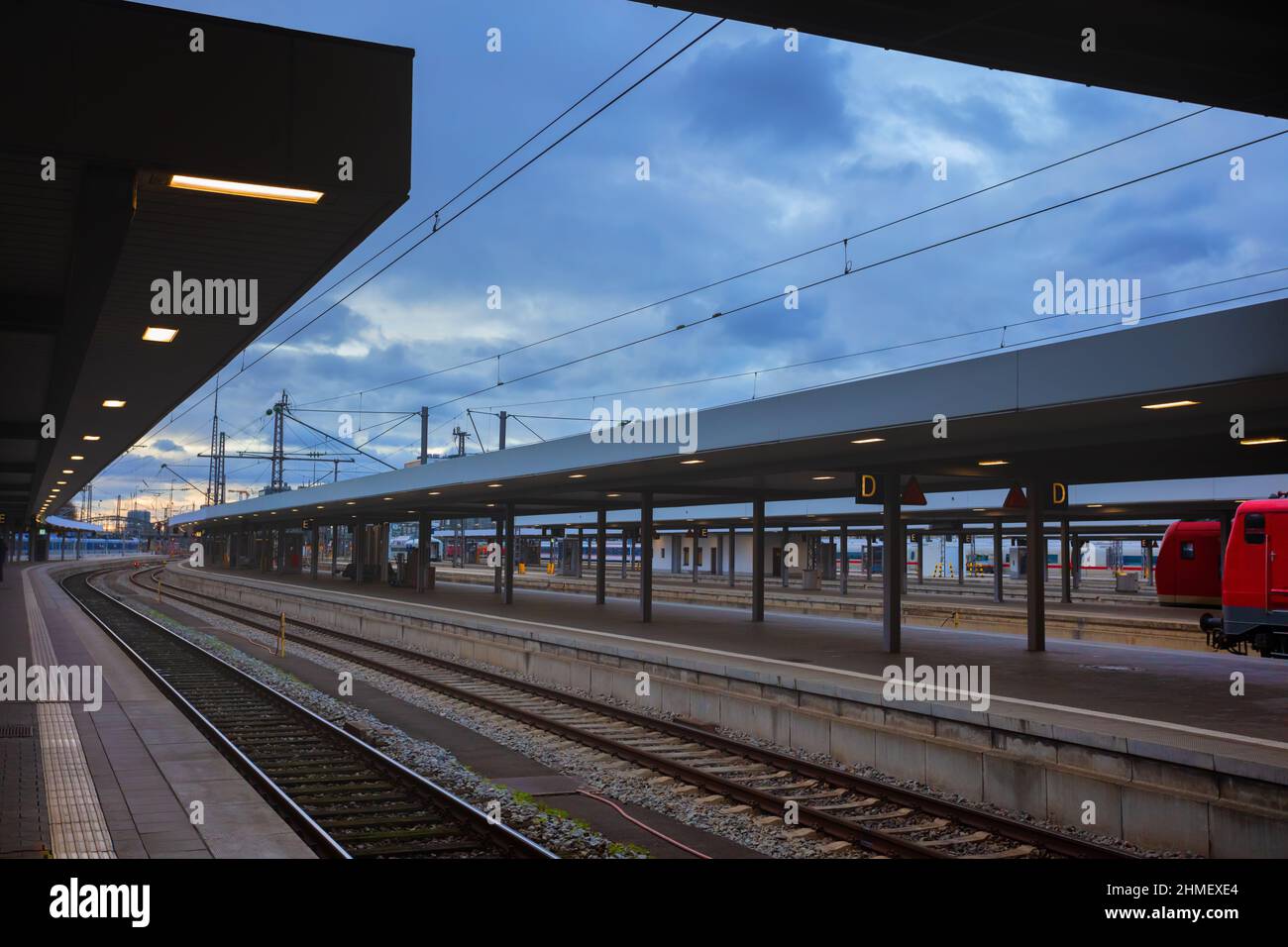 Platform, rails and locomotives on a train station Stock Photo - Alamy