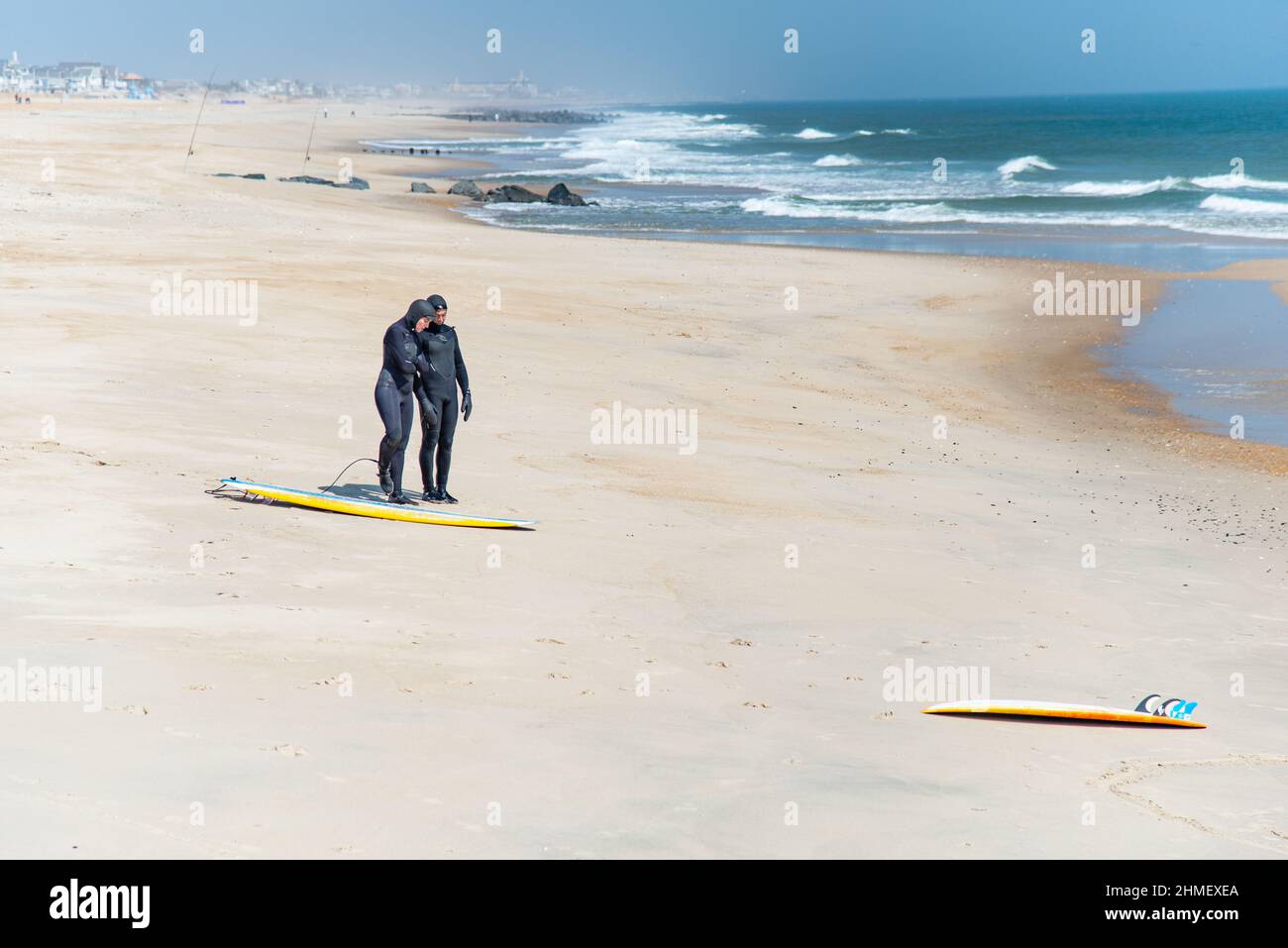 Surfers in landscape at Sea Girt beach in New Jersey USA Stock Photo ...