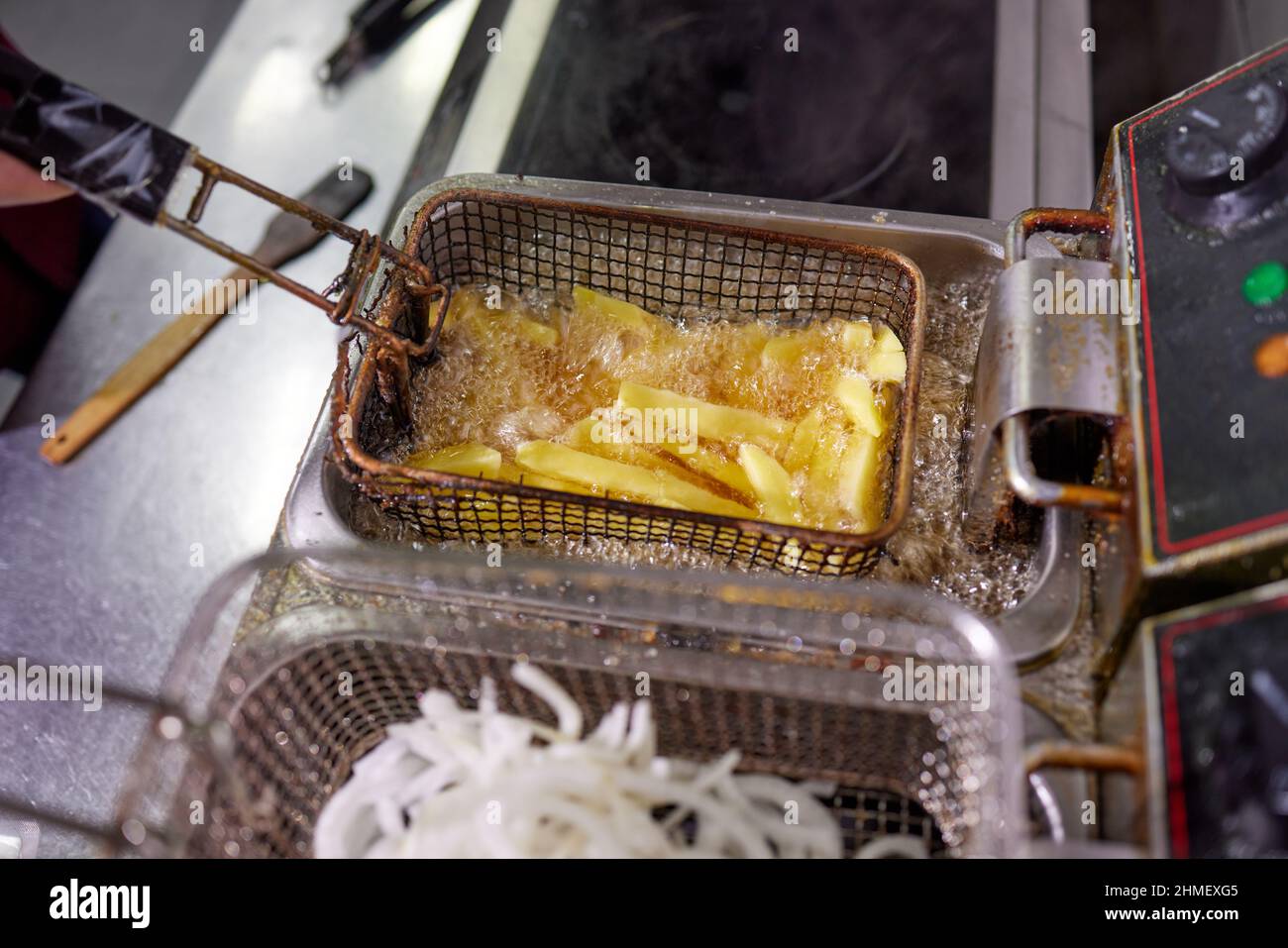 Dirty cooking area with french fries deep fryer Stock Photo - Alamy
