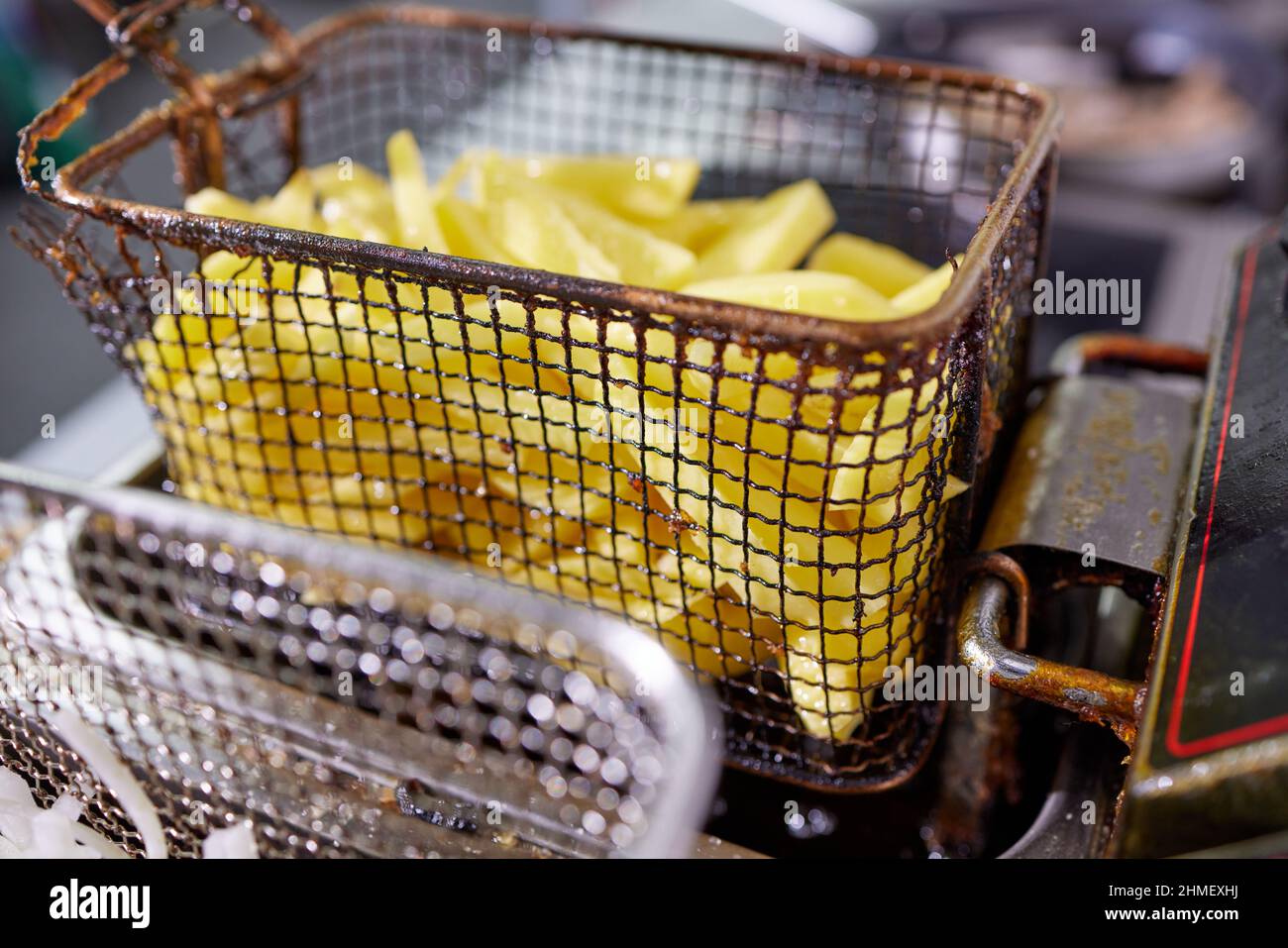 Dirty cooking area with french fries deep fryer Stock Photo - Alamy