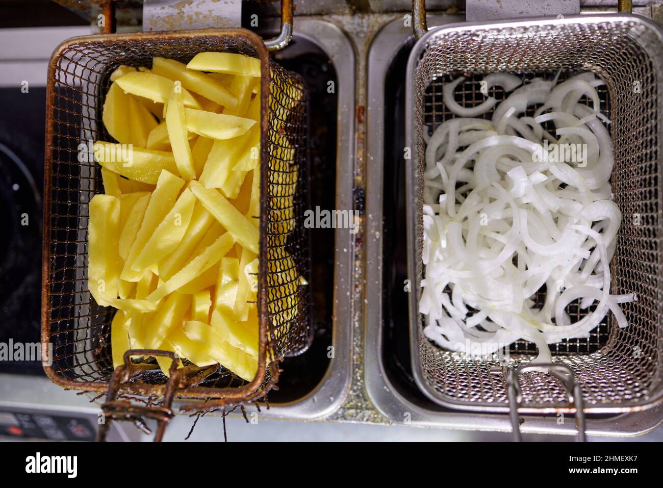 Dirty cooking area with french fries deep fryer Stock Photo - Alamy