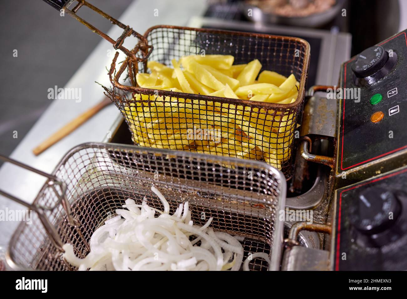 Dirty cooking area with french fries deep fryer Stock Photo - Alamy