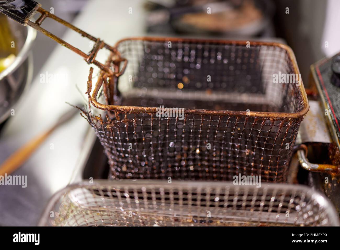Dirty cooking area with french fries deep fryer Stock Photo - Alamy