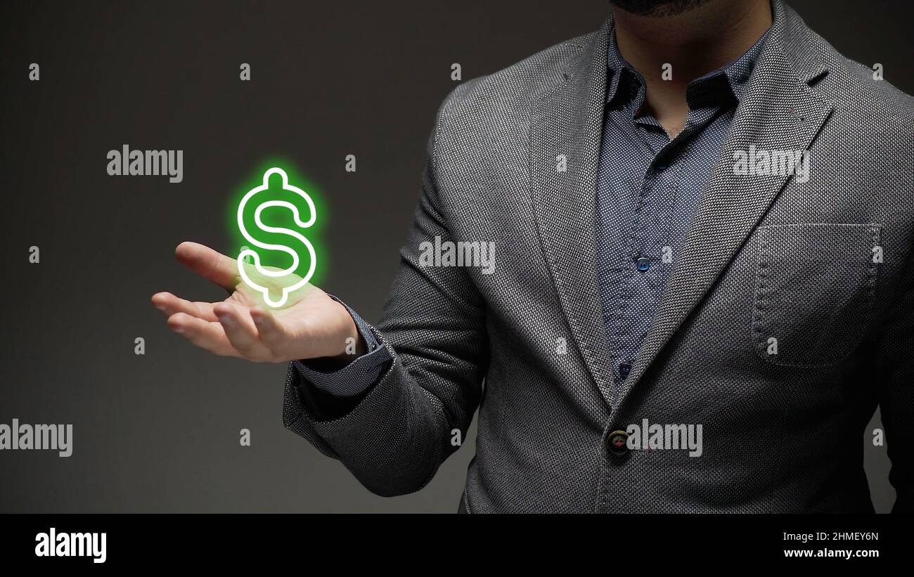 Close-up shot of a businessman holding a 3D rendered dollar sign ...