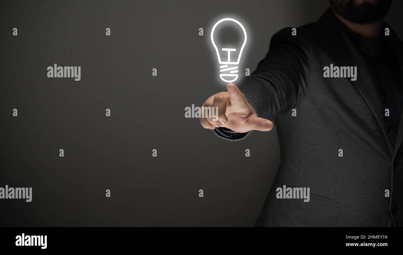 Close-up shot of a businessman showing a 3D rendered bright idea ...