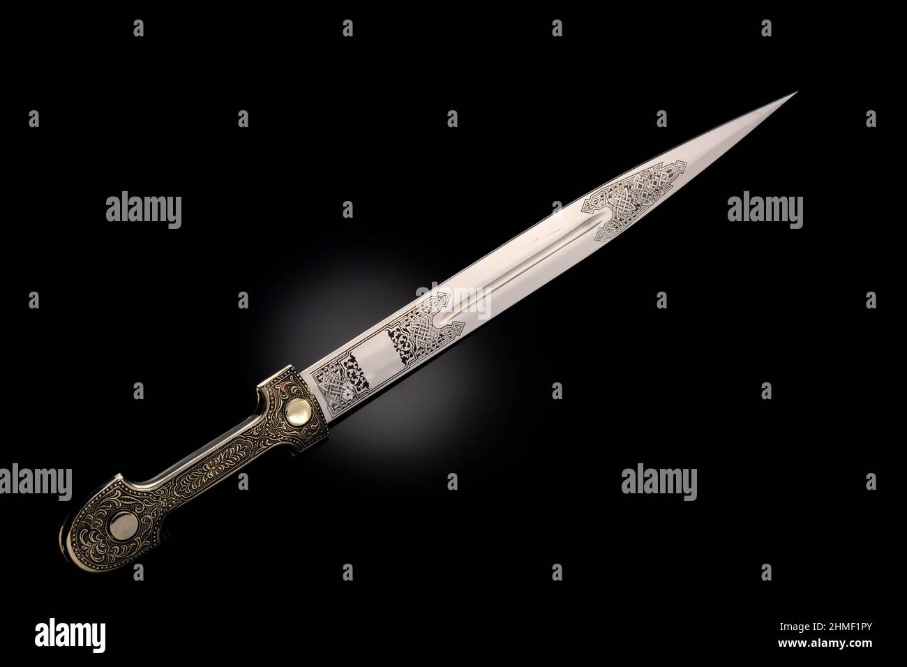 souvenir collectible silver dagger with scabbard on black. Luxury ...