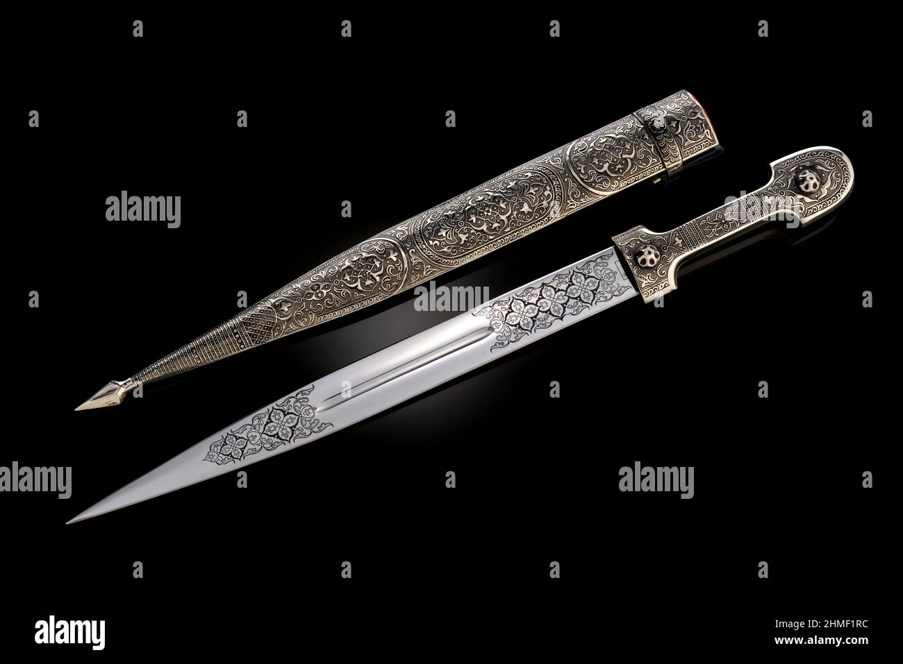 souvenir collectible silver dagger with scabbard on black. Luxury ...