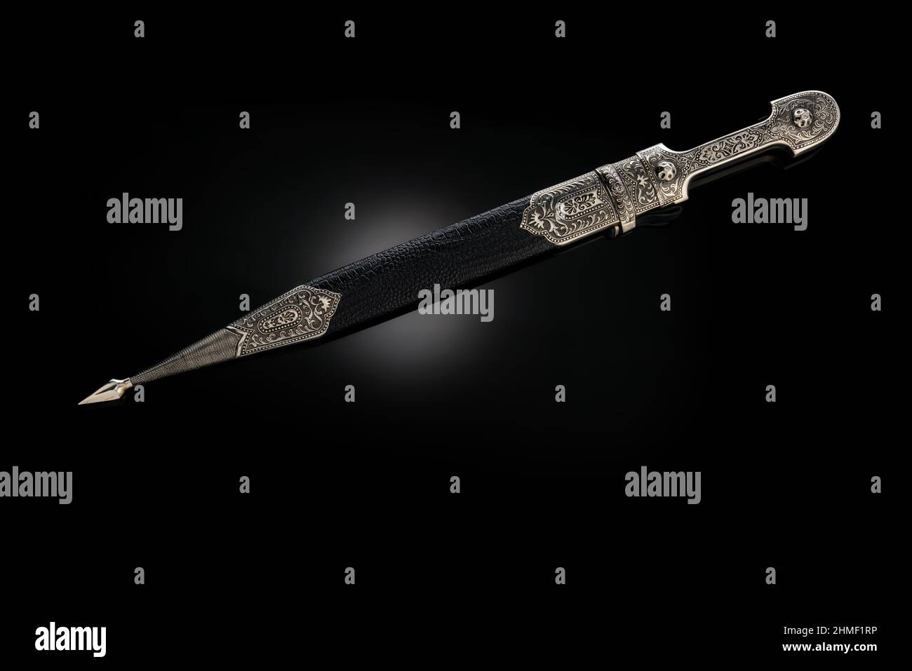 souvenir collectible silver dagger with scabbard on black. Luxury ...