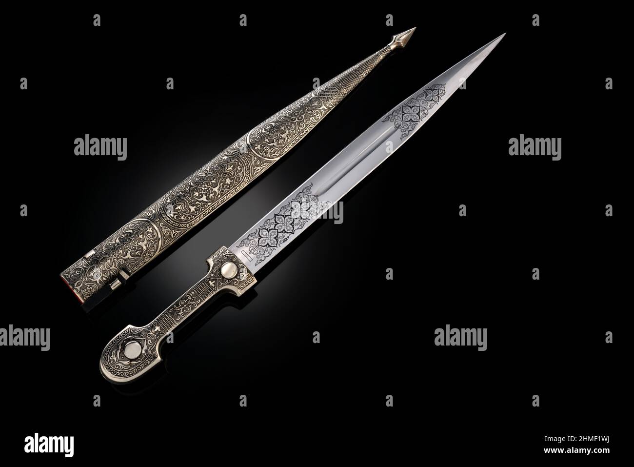 souvenir collectible silver dagger with scabbard on black. Luxury ...