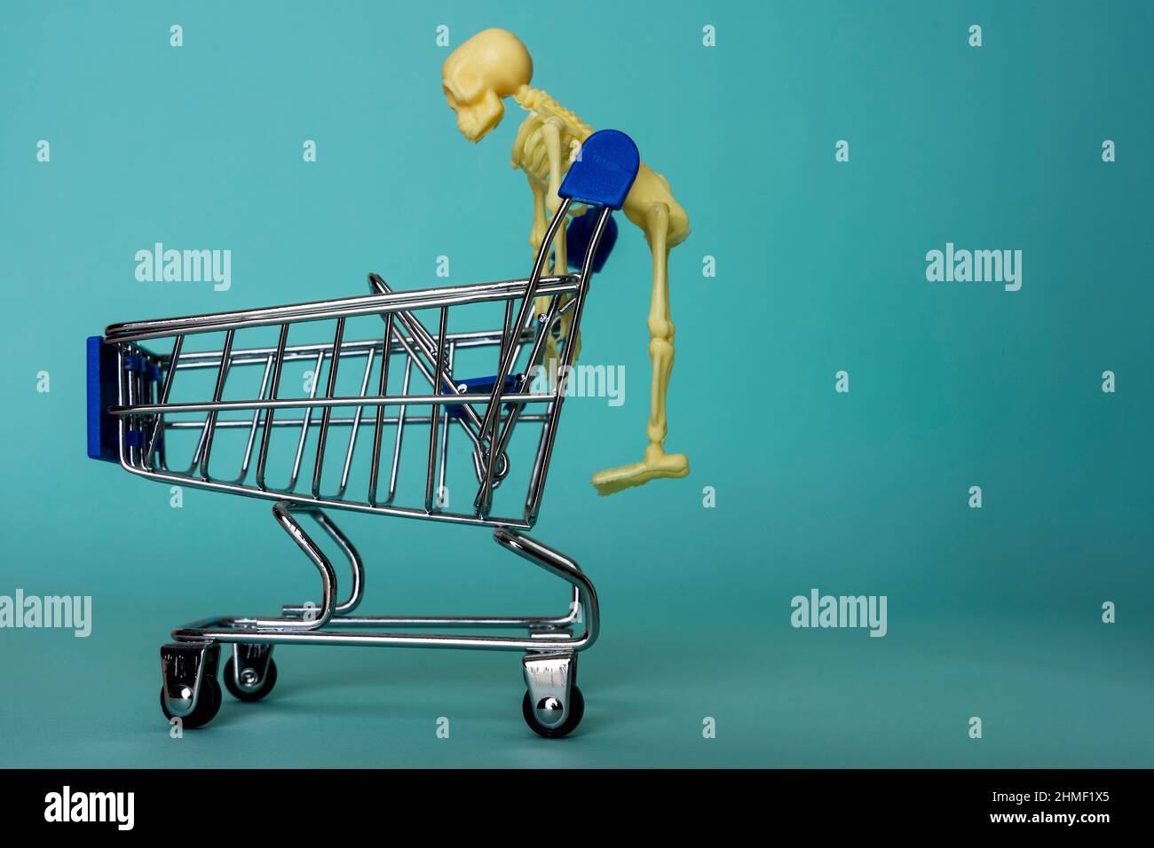 creative minimalist composition, a skeleton riding on a supermarket ...
