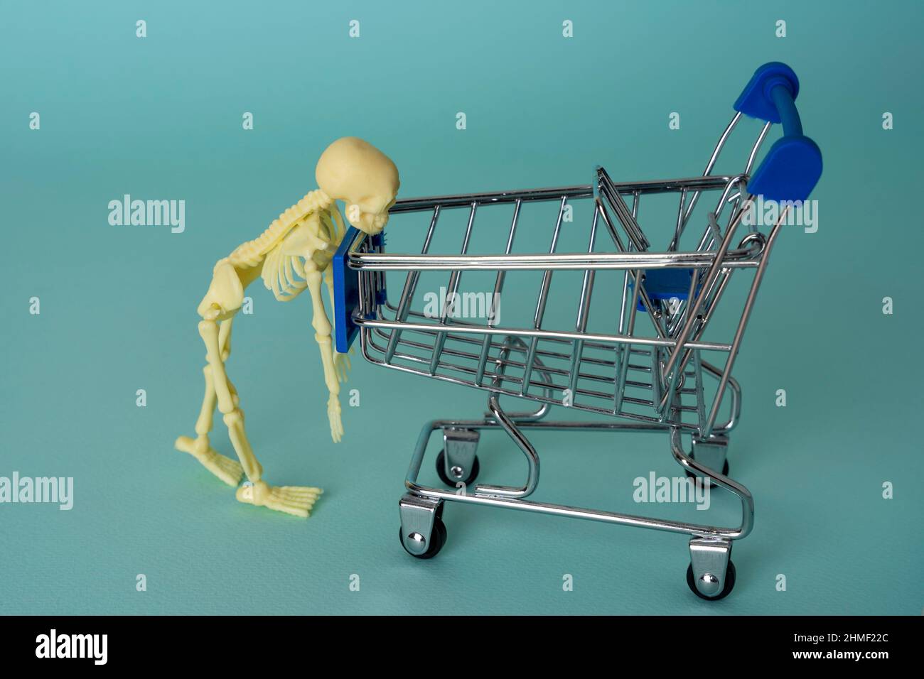 creative minimalist composition, a skeleton riding on a supermarket ...