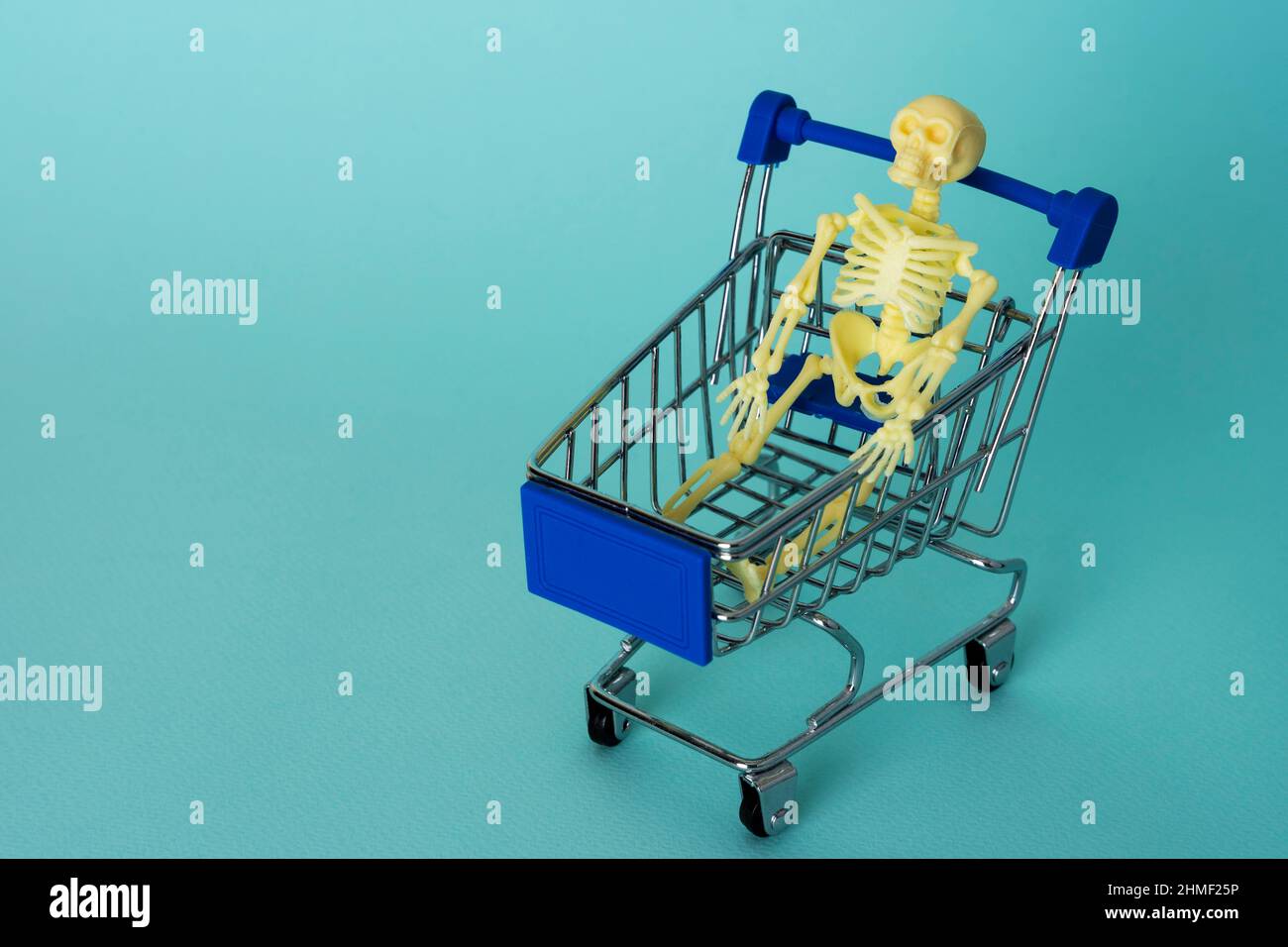 creative minimalist composition, a skeleton riding on a supermarket ...