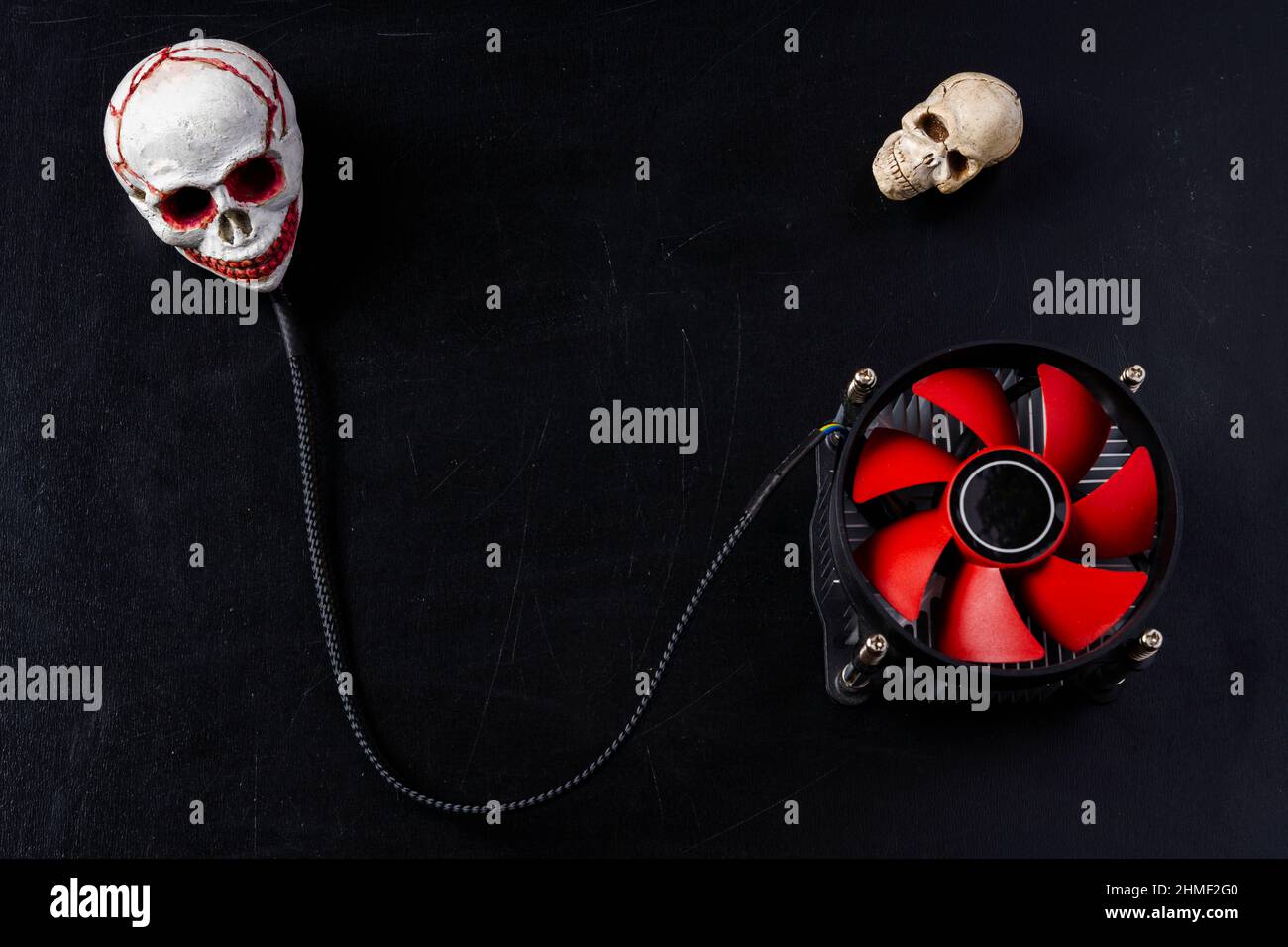 Creative composition, a computer cooler connected to a skull, an image ...