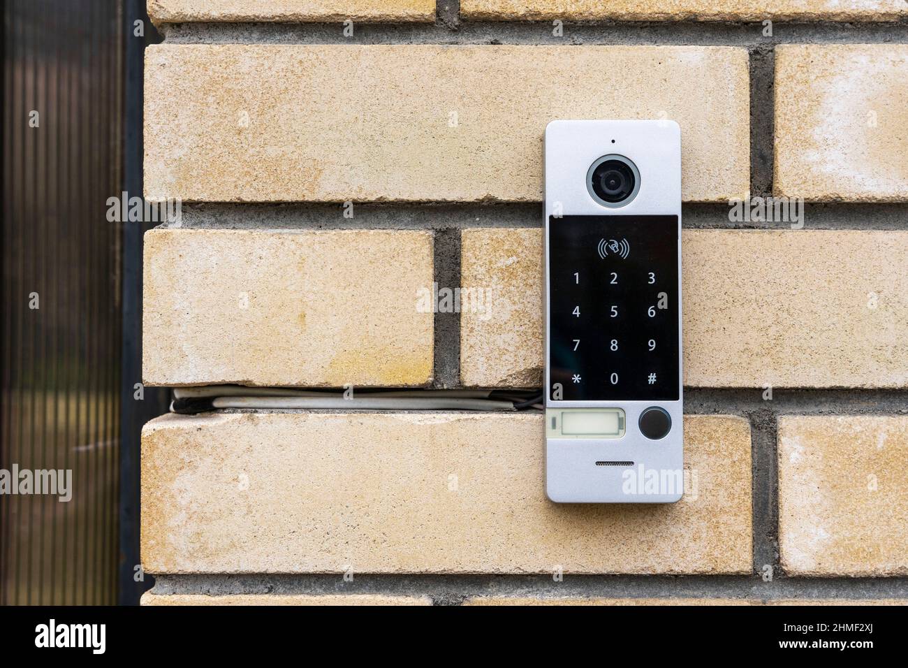 an intercom on the door of a private house, an intercom panel with a ...