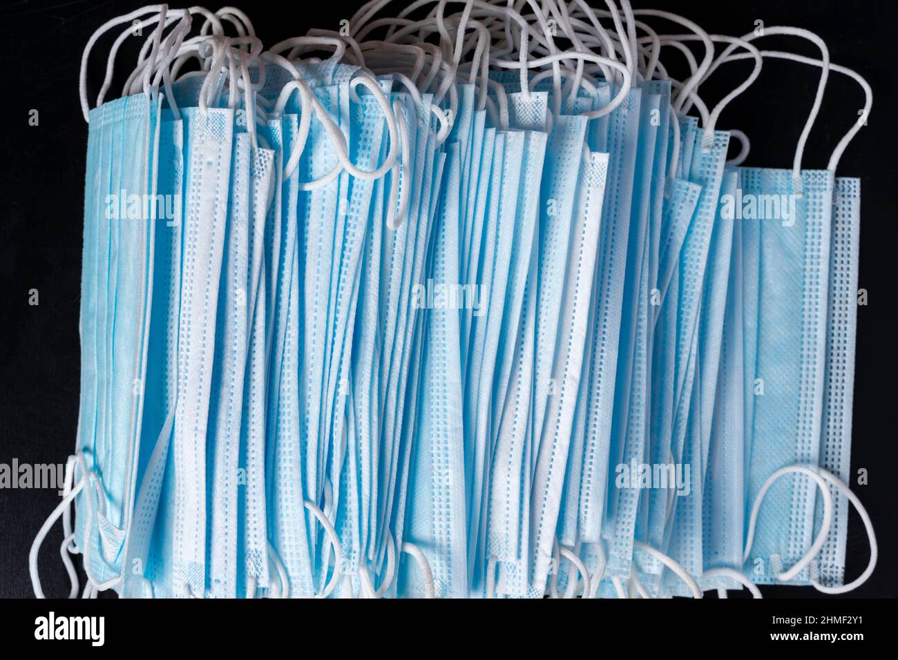 a stack of medical masks, a close-up of protective face masks to ...