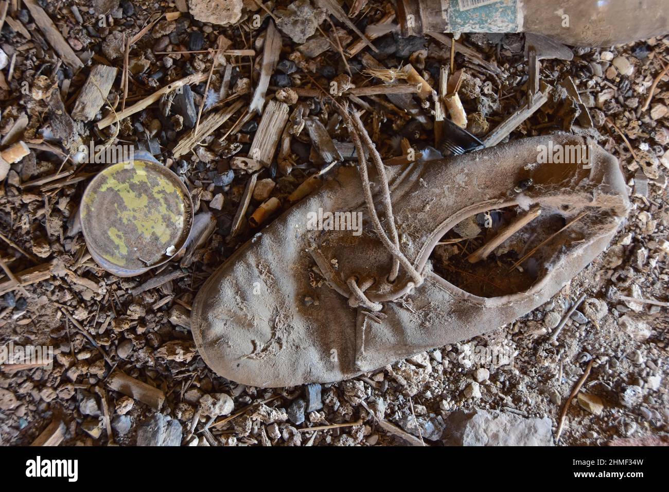 Marred leather loafer on the floor, rotten shoe, shoe wreck, rotten ...