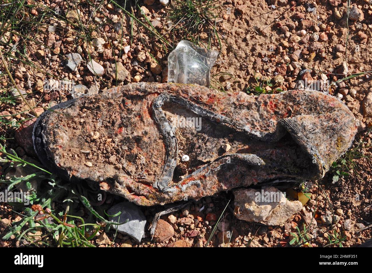 Old slipper on the floor, rotten shoe, wrecked shoe, rotten shoe, worn ...