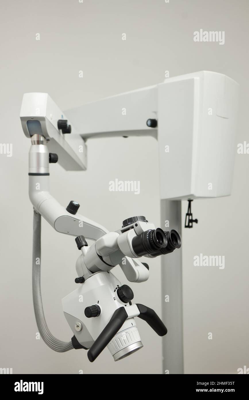 Dental microscope on the background of modern dentistry. Medical ...