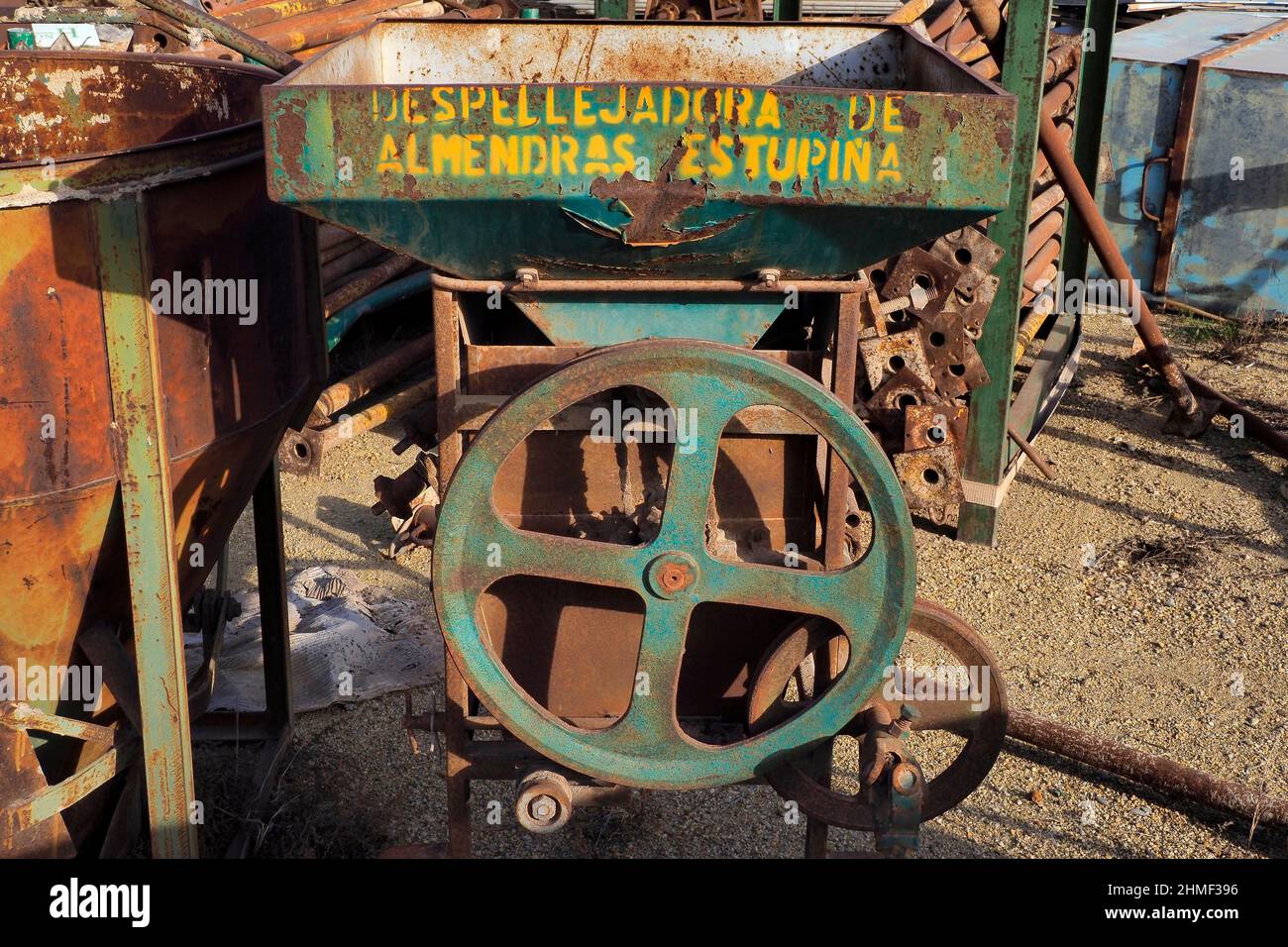 Iron almond mill on scrap yard, hand-operated mill for almonds ...
