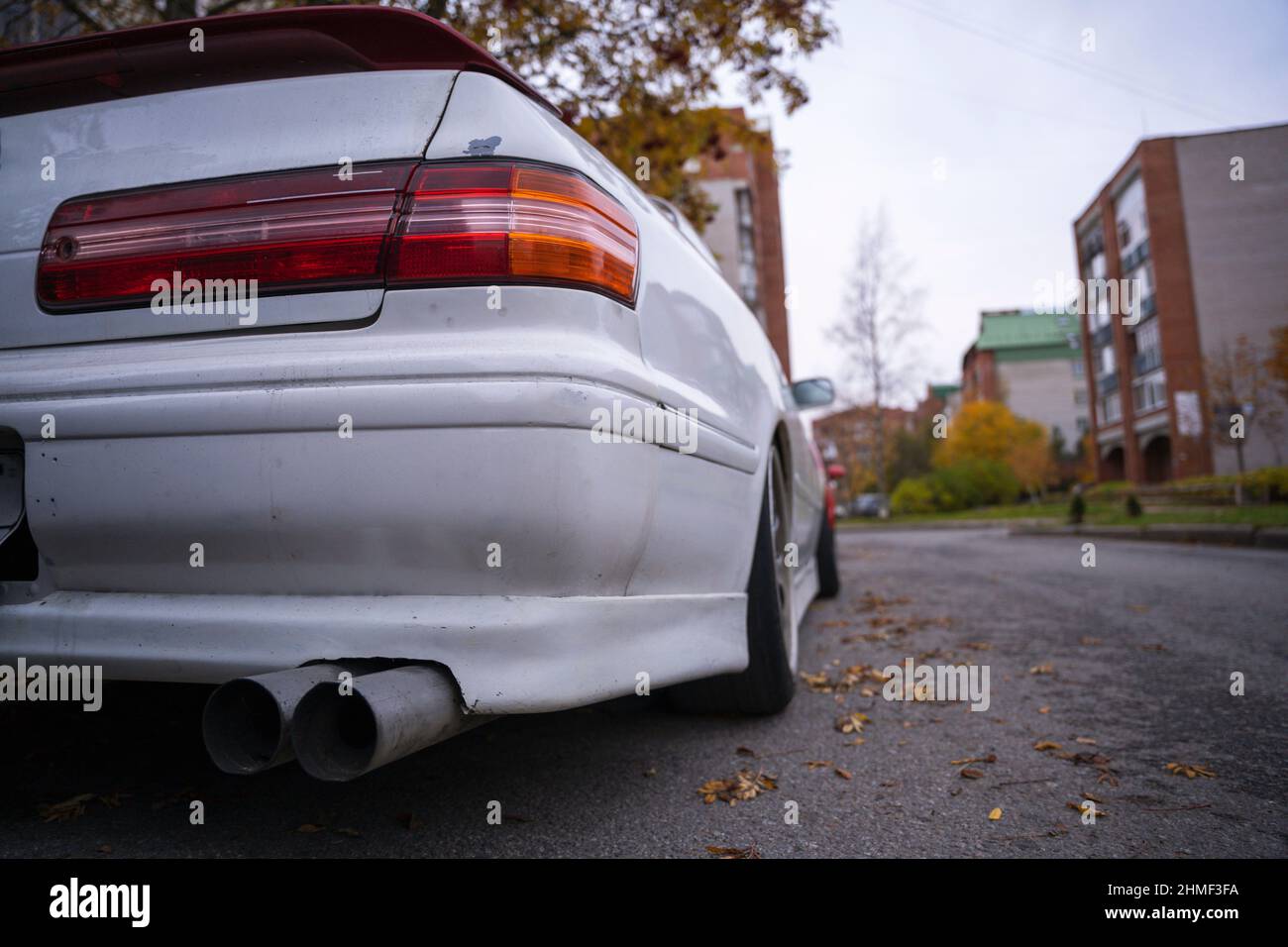 An old classic Japanese car in an autumn urban landscape, a popular ...