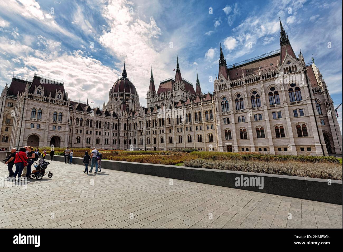 Visitors in front of parliament building at Kossuth Square, backlight ...