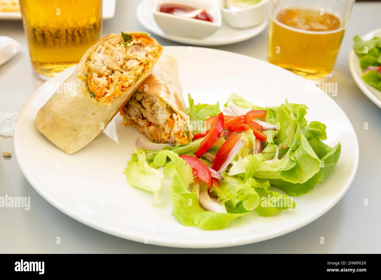 Chicken wraps with fresh green salad and vegetables Stock Photo - Alamy