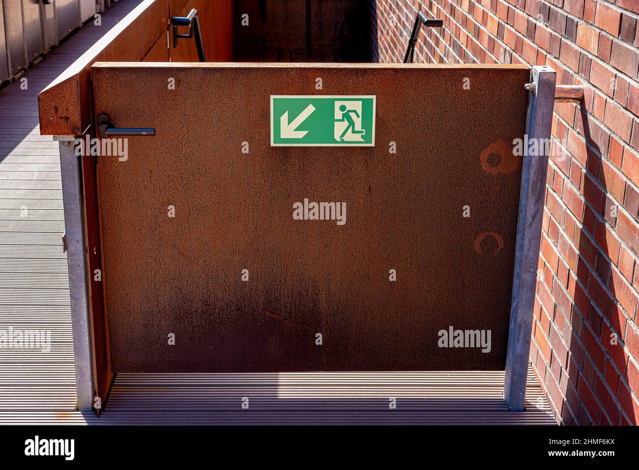 Emergency exit on a rusty steel door, Hamburg, Germany Stock Photo - Alamy