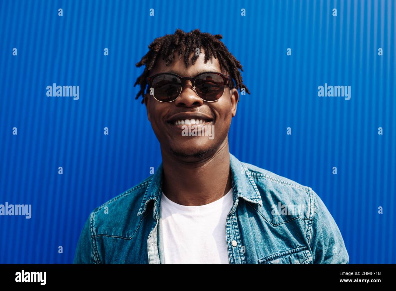 Young happy curly smiling african american man in casual wear and ...