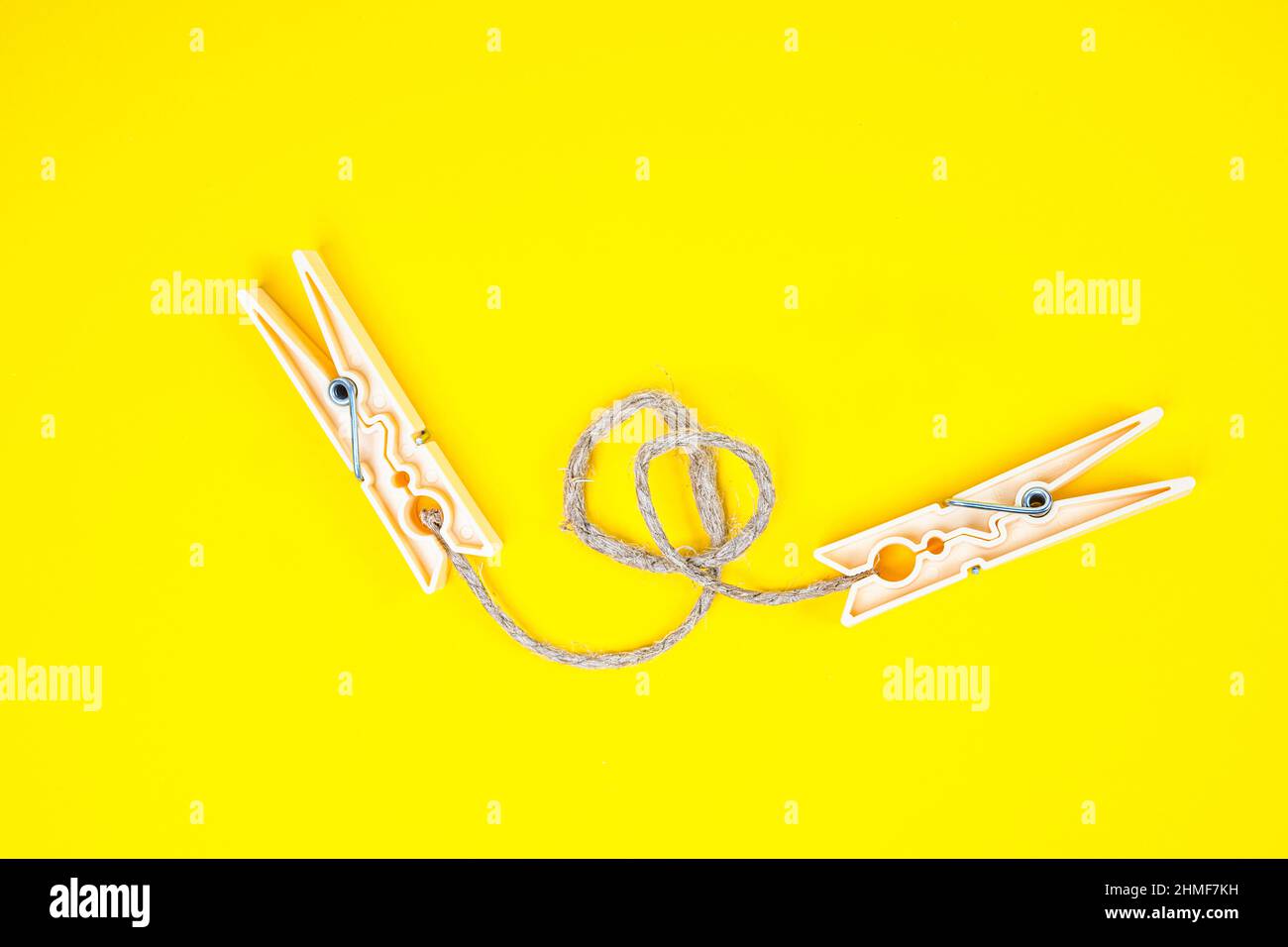 The Connection With A String Between Two Clothespins Stock Photo Alamy
