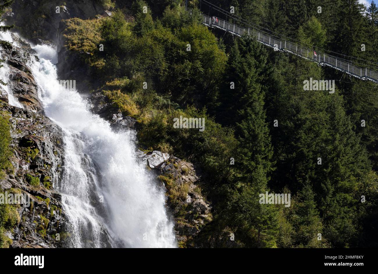 Hiking trail over a suspension bridge along the Stuibenfall near ...