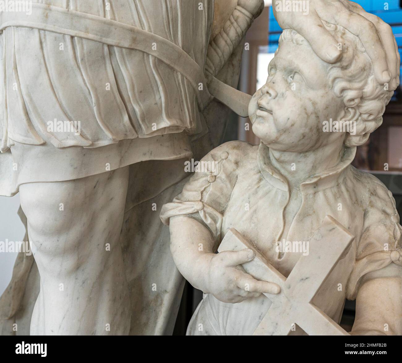 Marble statue of an ancient warrior with child in the staircase of the ...