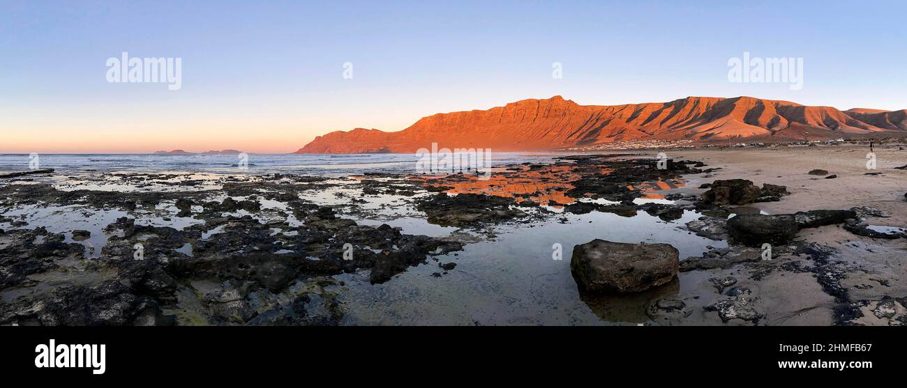 Evening light at Caleta de Famara beach, Lanzarote, Spain Stock Photo ...