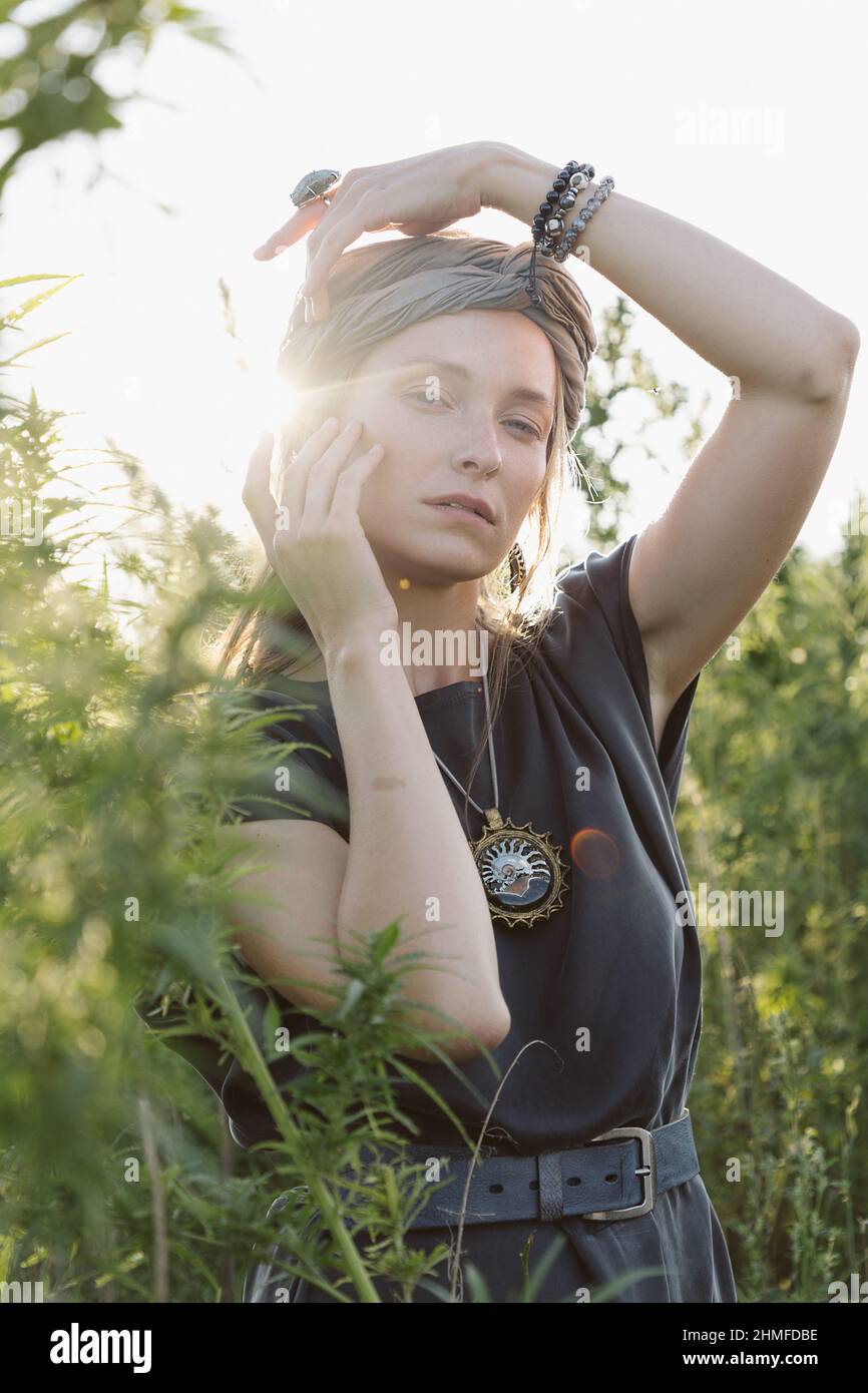 Woman in the Cannabis plant, Girl standing with Marijuana or Hem Stock ...