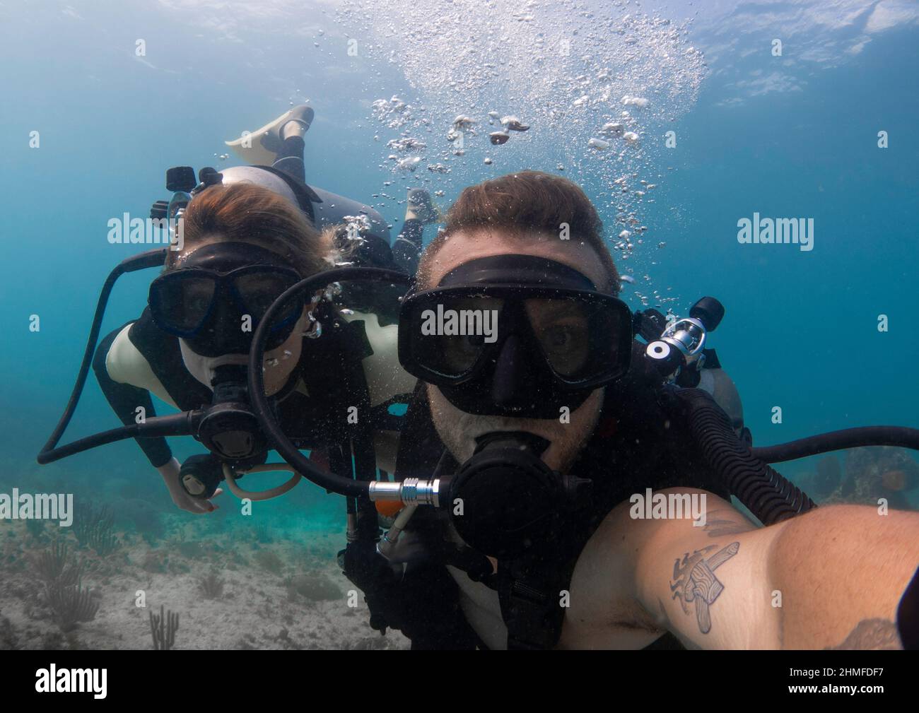 young couple scuba diving and taking a selfie Stock Photo - Alamy