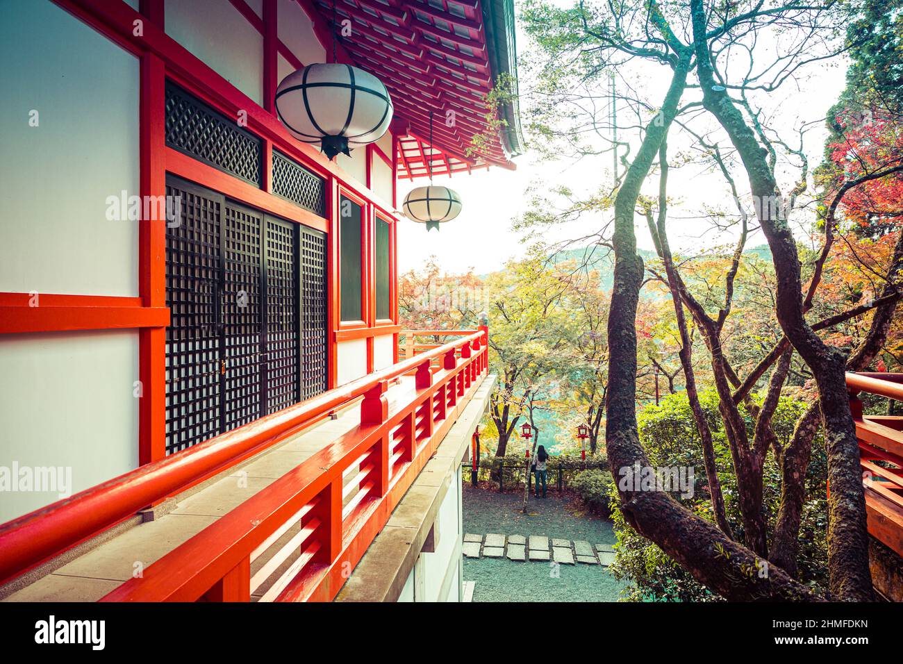 Traditional Japanese temple architecture in a forest with fall colors ...