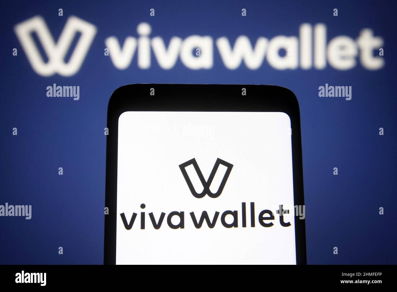 In this photo illustration, Viva Wallet logo is seen on a smartphone ...