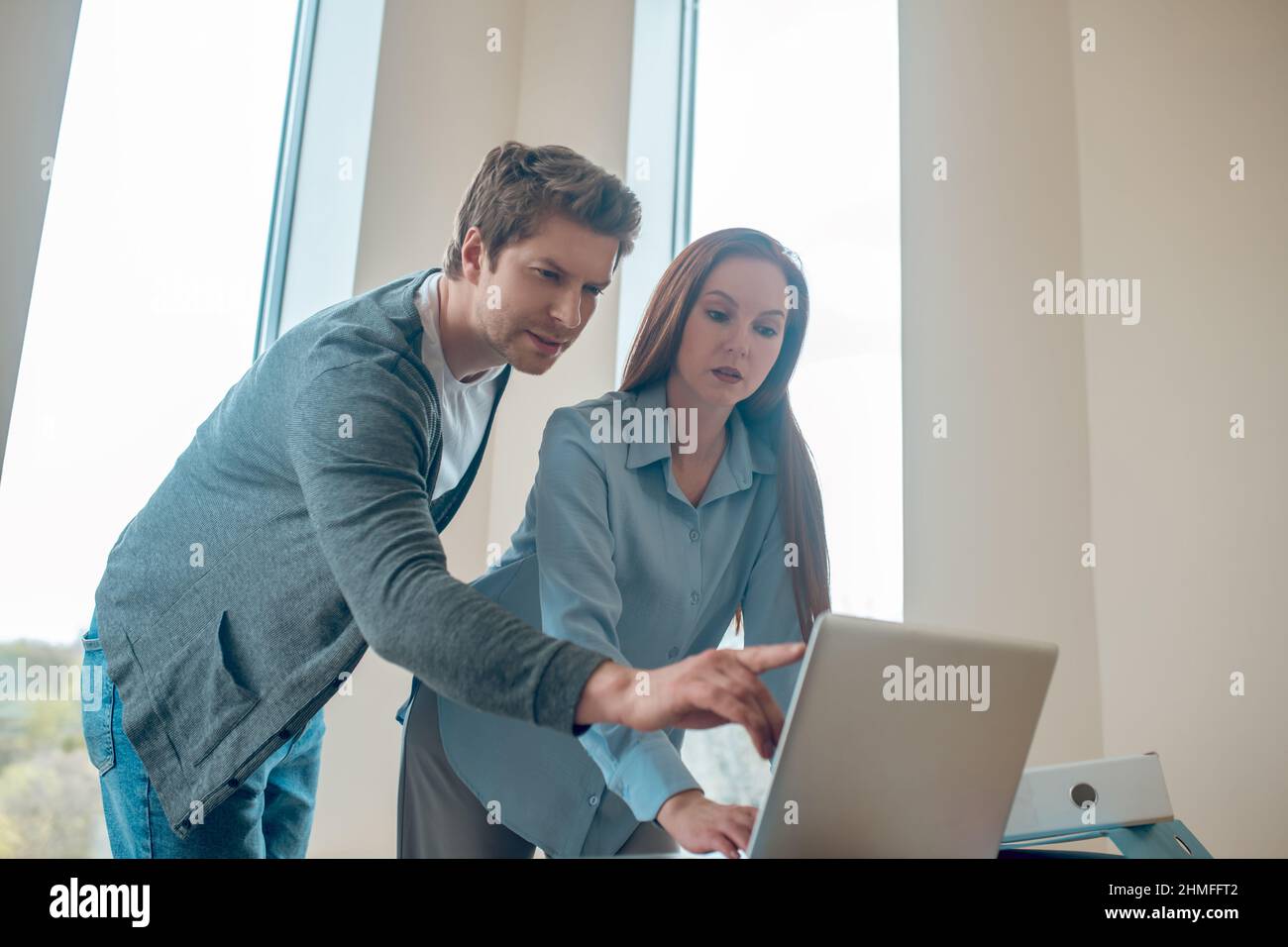 Carefully looking at screen hi-res stock photography and images - Alamy