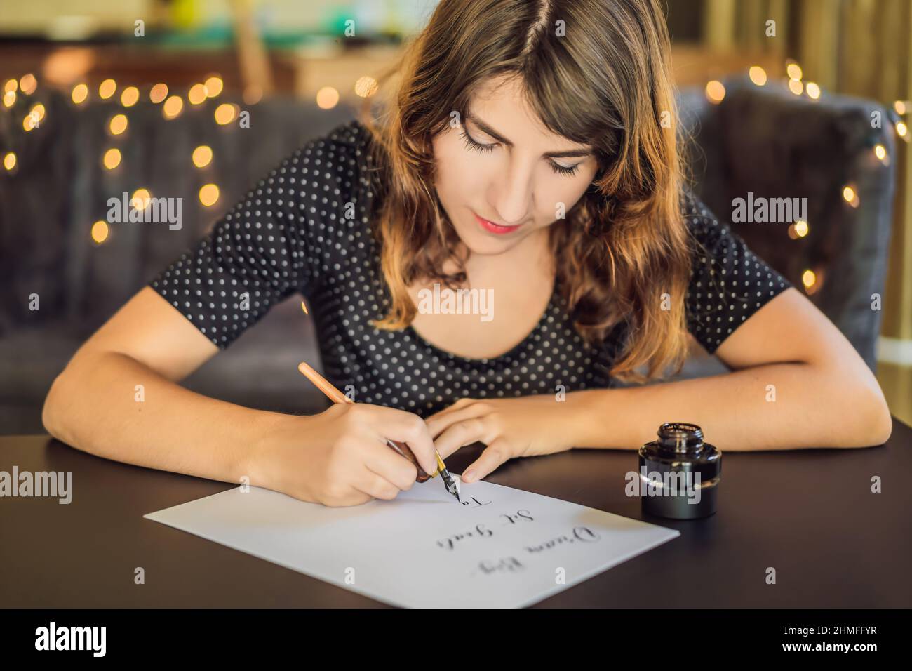 dream big set goals take action. Calligrapher Young Woman writes phrase ...