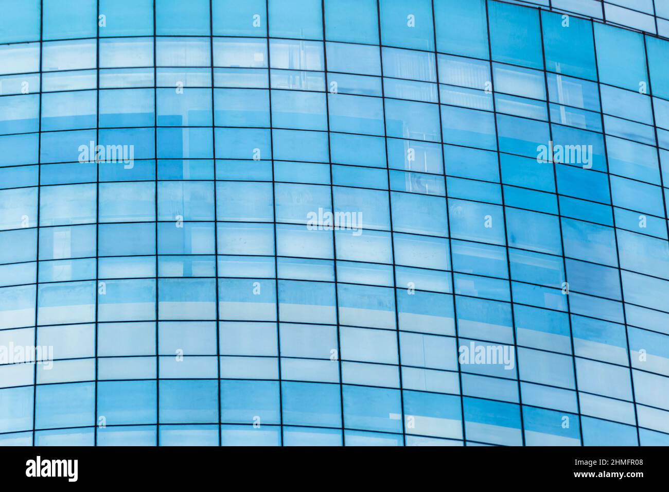 Blue glass windows of office building for background Stock Photo - Alamy
