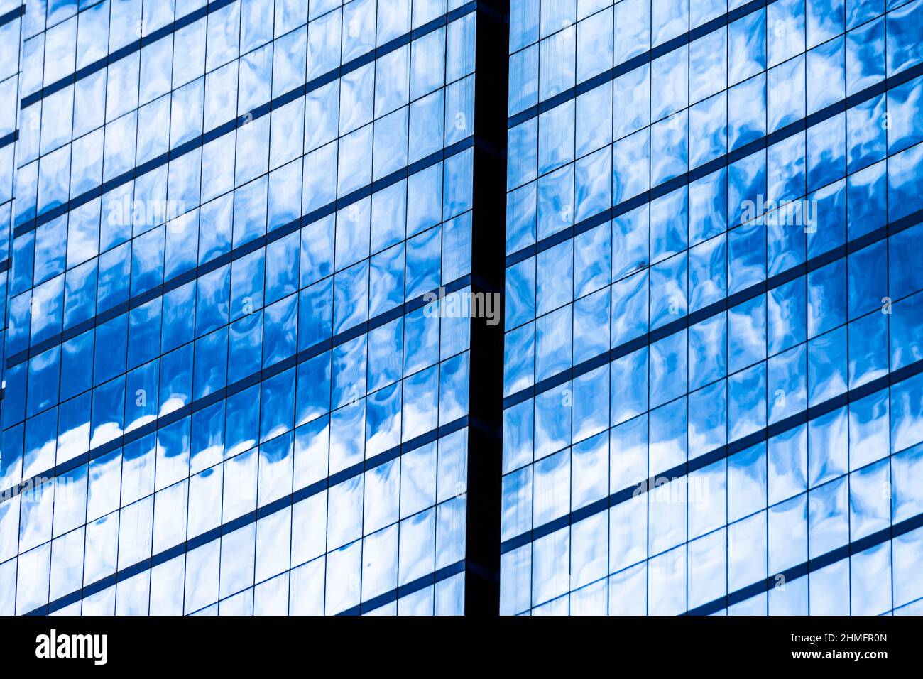 Blue glass windows of office building for background Stock Photo - Alamy