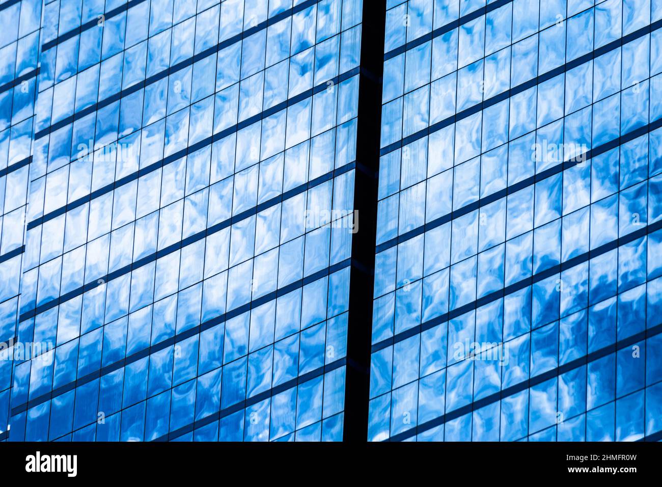 Blue glass windows of office building for background Stock Photo - Alamy