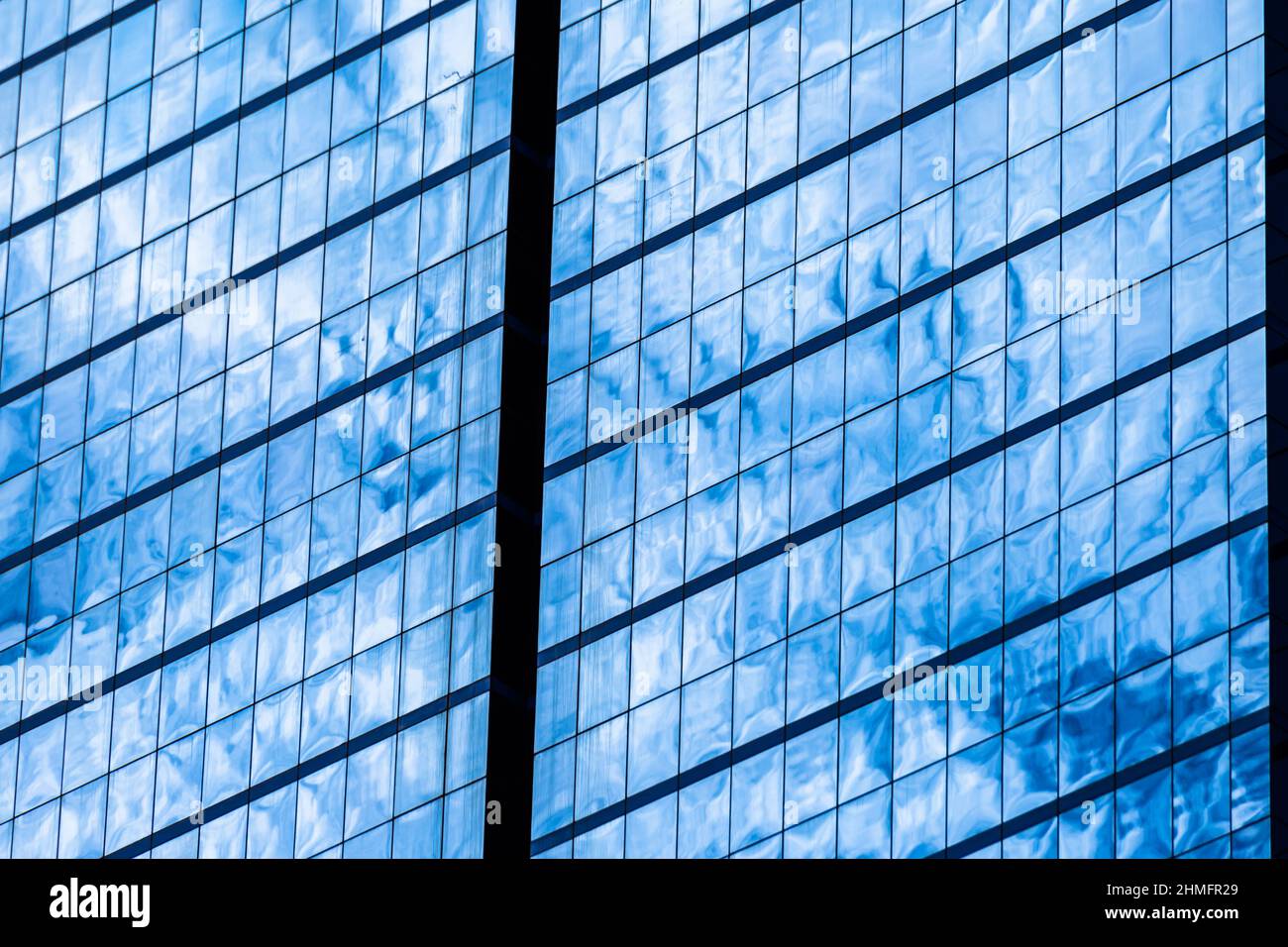 Blue glass windows of office building for background Stock Photo - Alamy