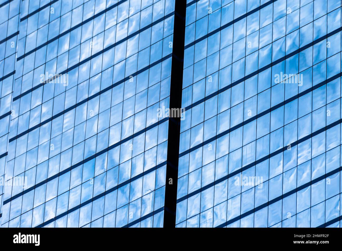 Blue glass windows of office building for background Stock Photo - Alamy