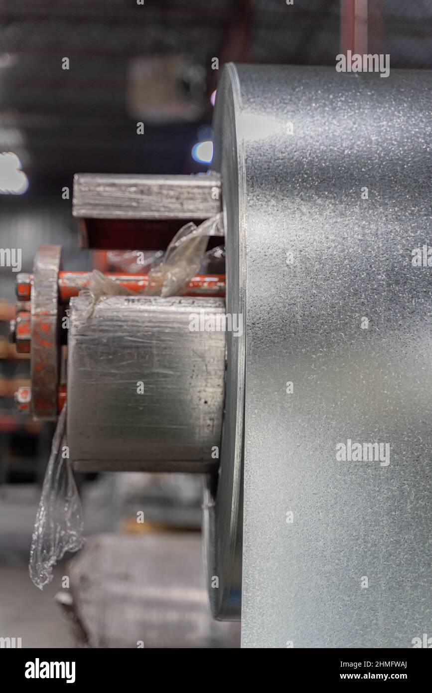roll of silver metal steel coil in a metal roofing factory Stock Photo ...