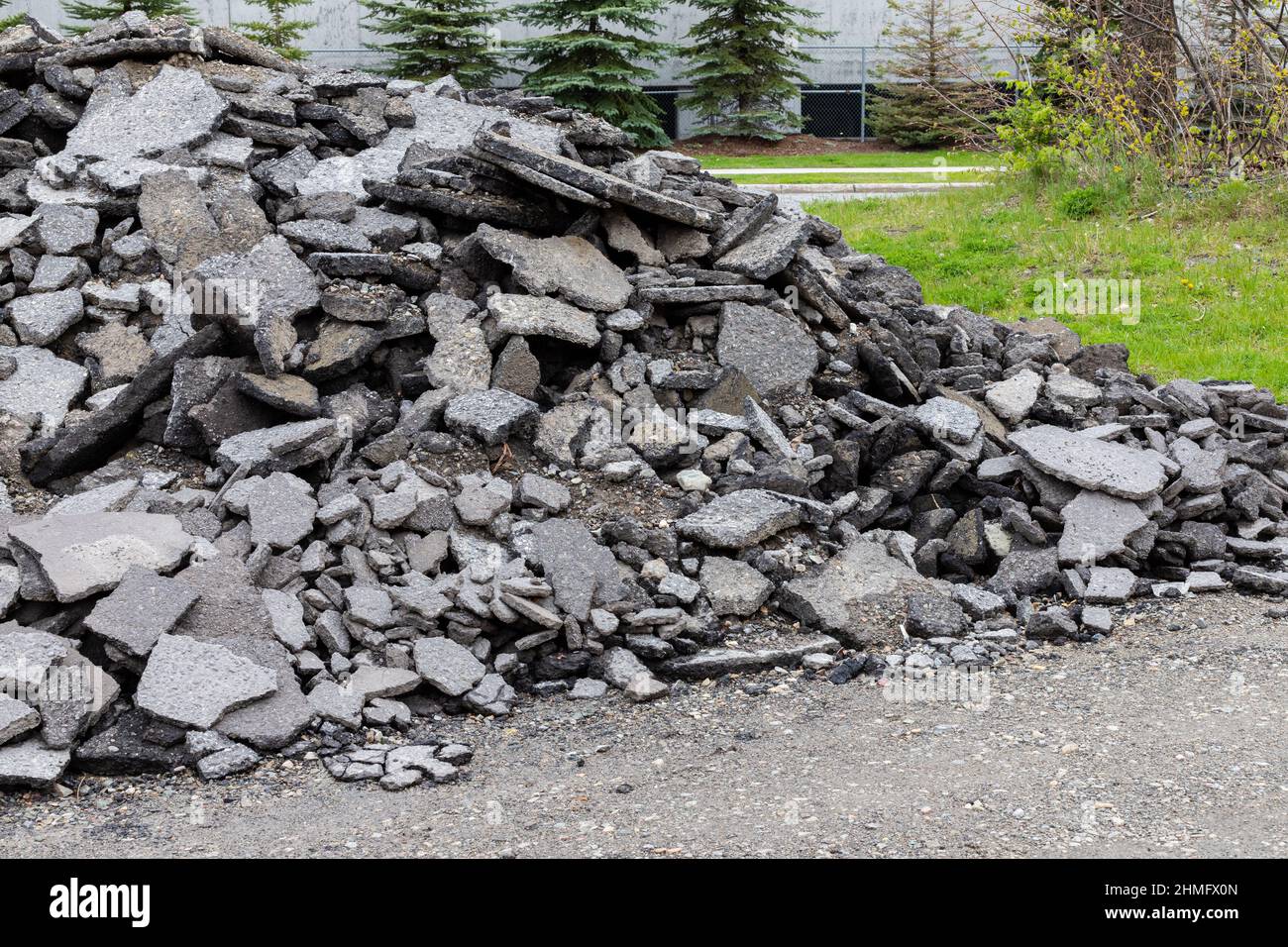 Pile of smashed old asphalt rubble on the ground. Road repairing ...