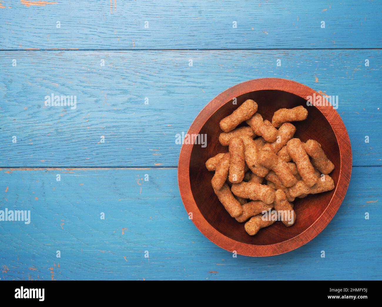 Organic crackers from lentils on a wooden background, space for your ...