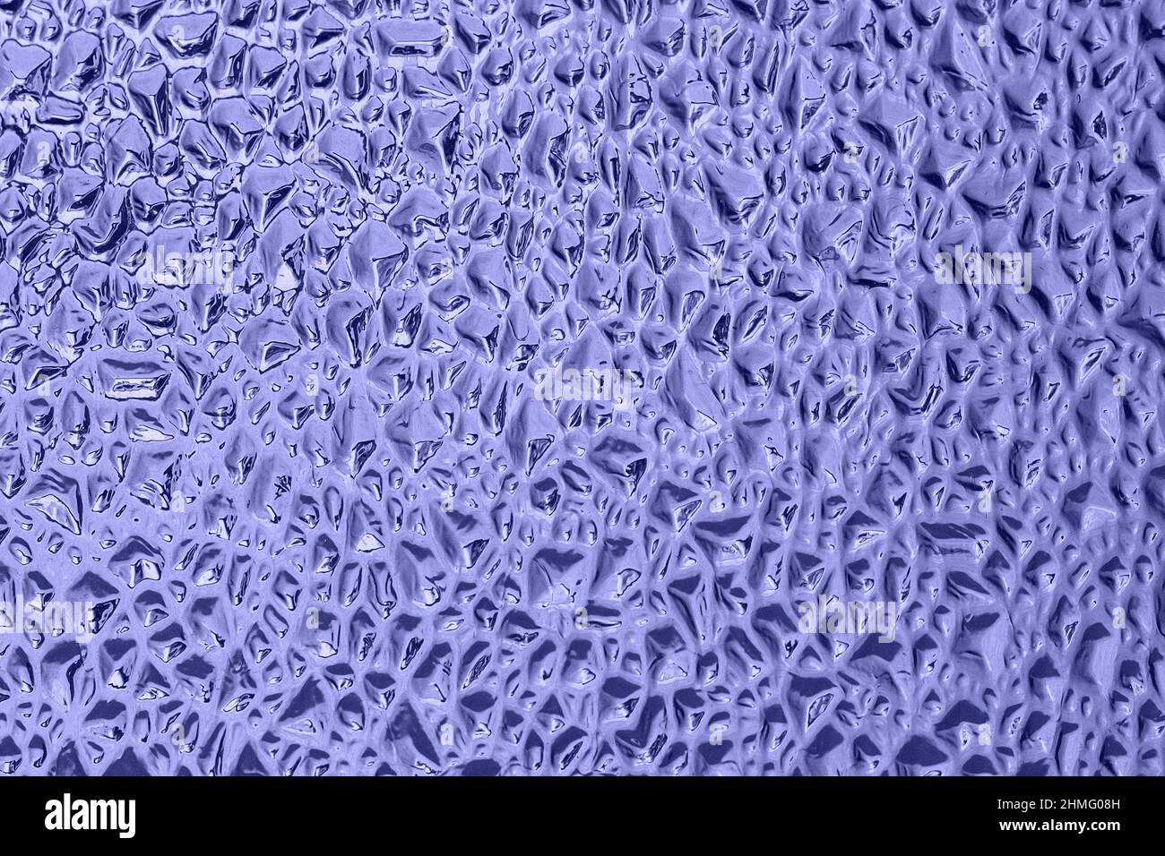 Decorative violet glass with a relief embossed pattern. Trendy color of ...