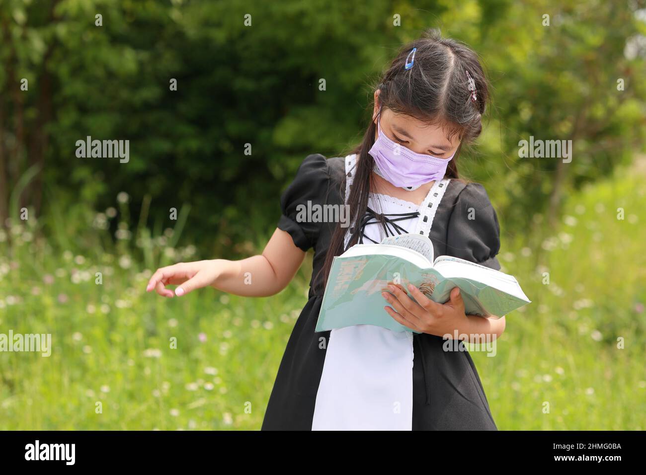 Child outdoor with dictionary hi-res stock photography and images - Alamy