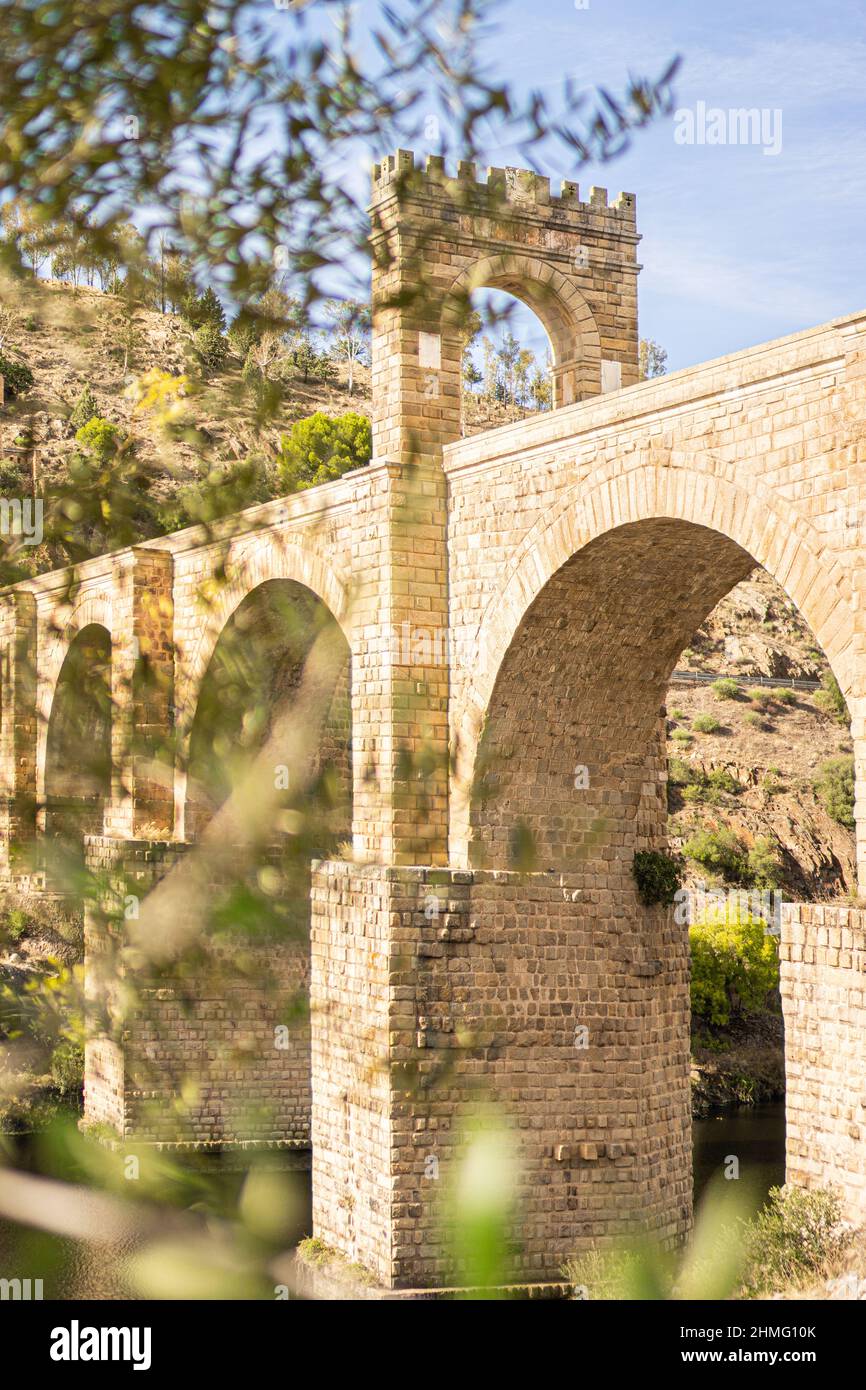 Old arched stone bridge in sunlight. Alcantara Bridge Stock Photo - Alamy